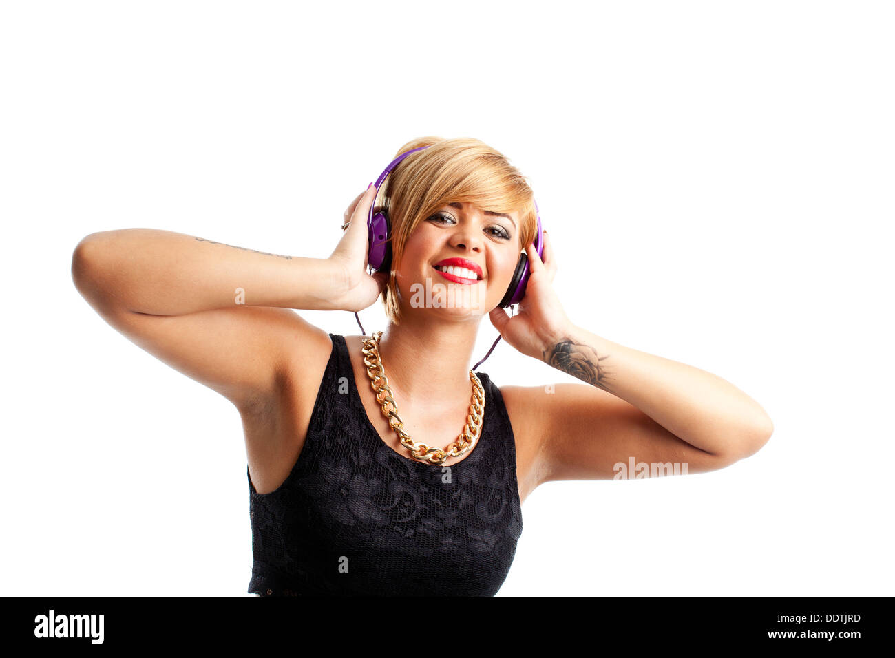 Pretty Female Model smiling listening to music Stock Photo - Alamy