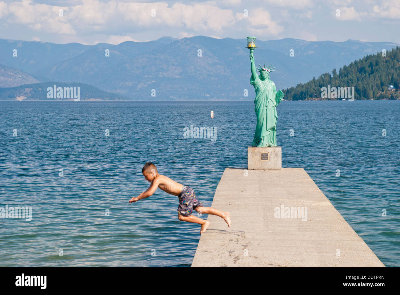 A young boy braves the chilly waters of Lake Pend Oreille, Sandpoint ...