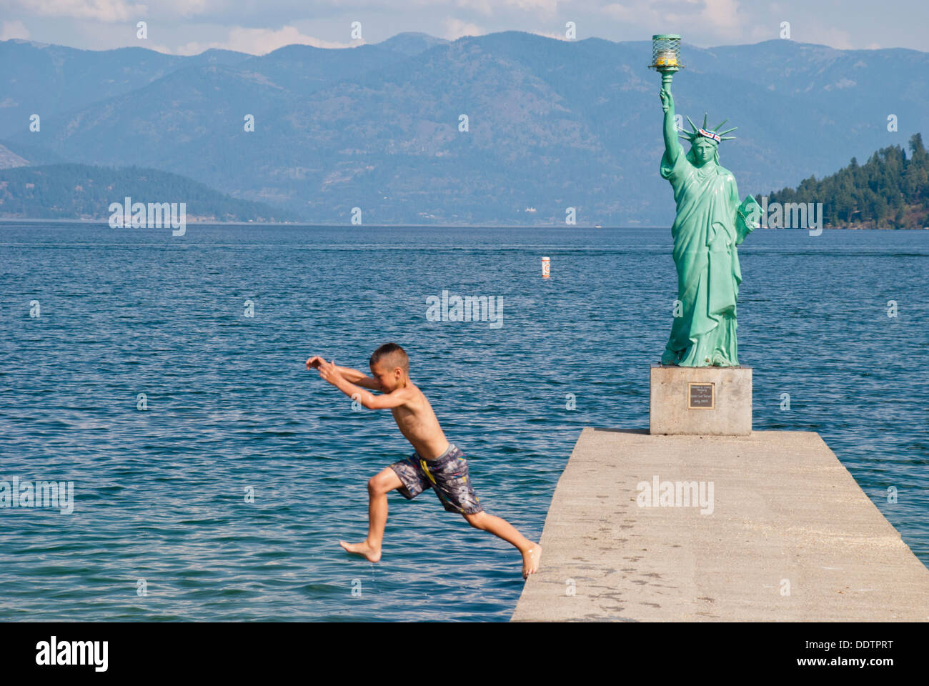 A young boy braves the chilly waters of Lake Pend Oreille, Sandpoint ...