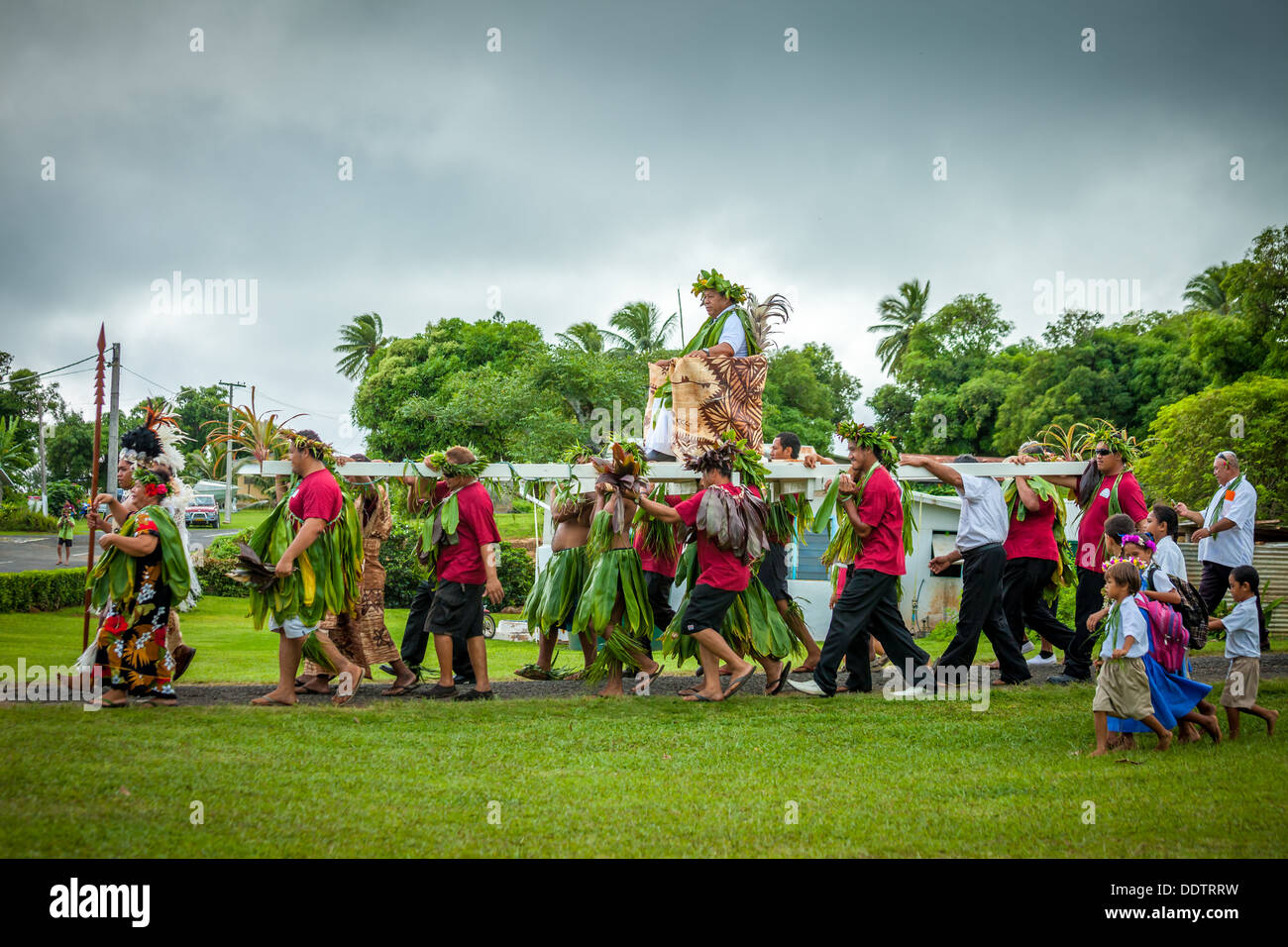 COOK ISLANDS - Makirau Haurua in traditional costume being carried on ...