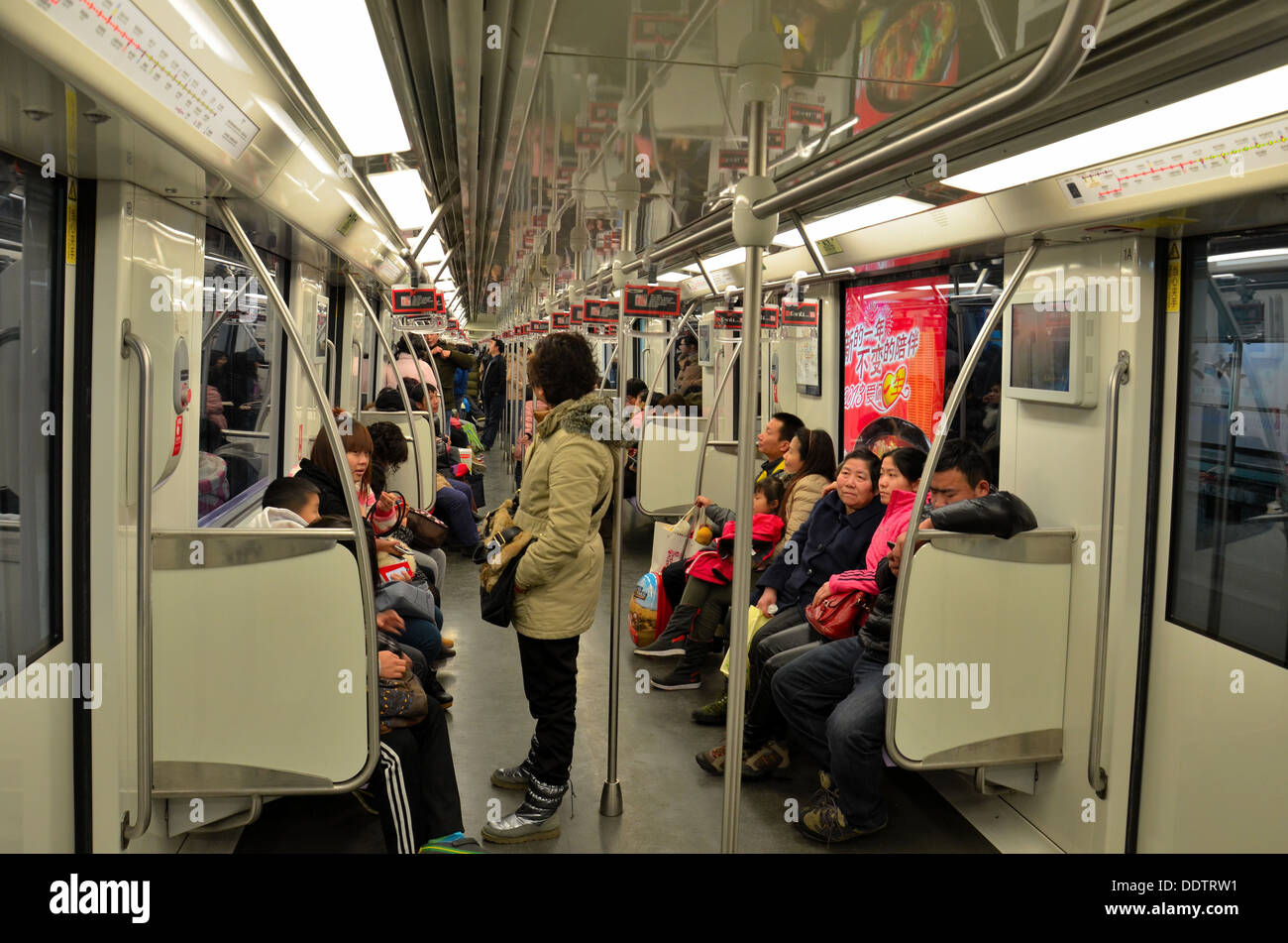 Commuters inside a Shanghai metro train railway carriage, China Stock ...