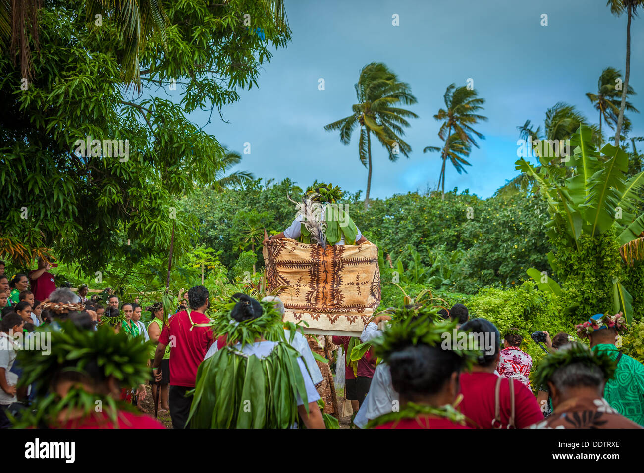 COOK ISLANDS - Makirau Haurua in traditional costume being carried on ...
