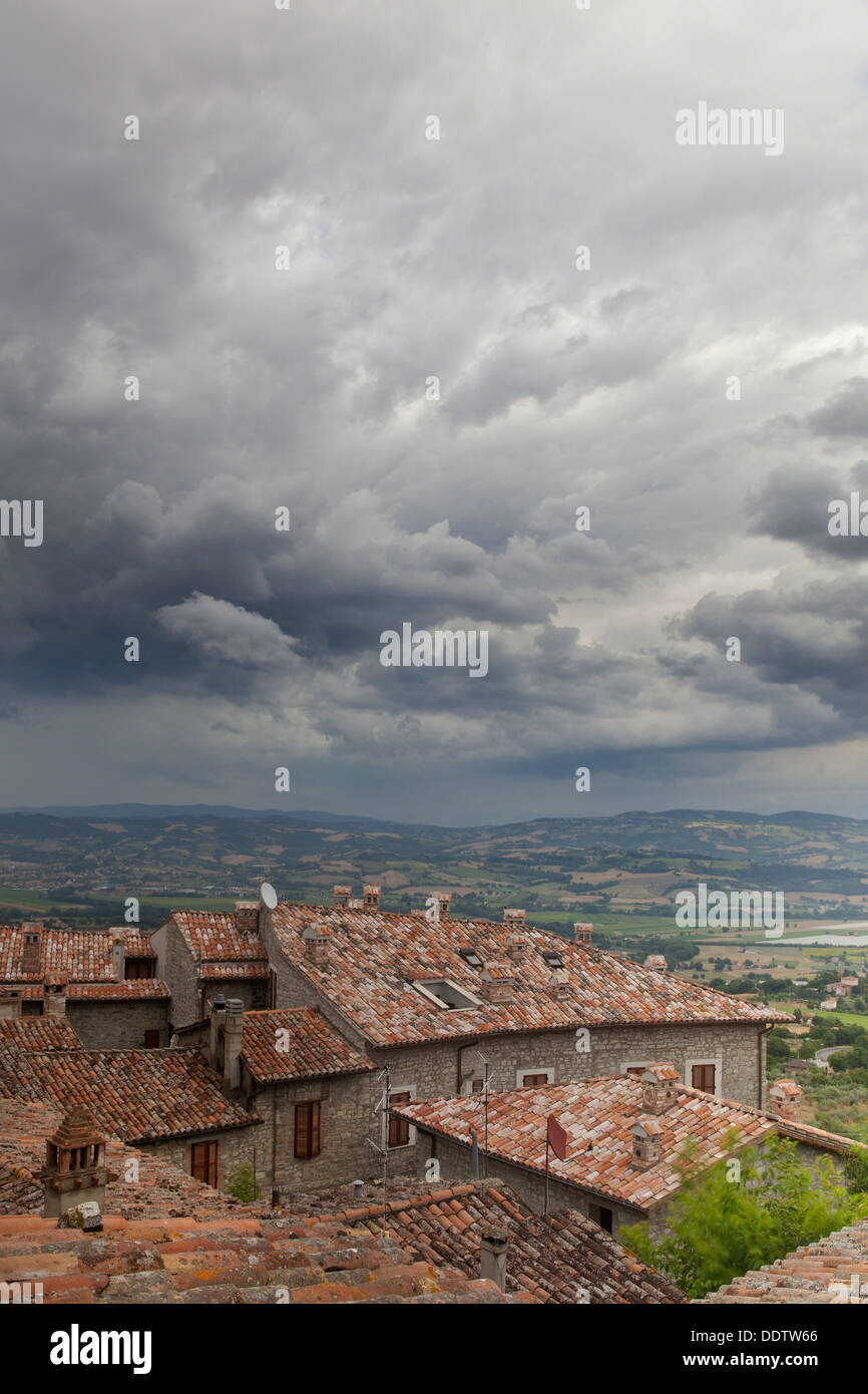 View over traditionally red-tiled terracotta rooftops of medieval stone ...