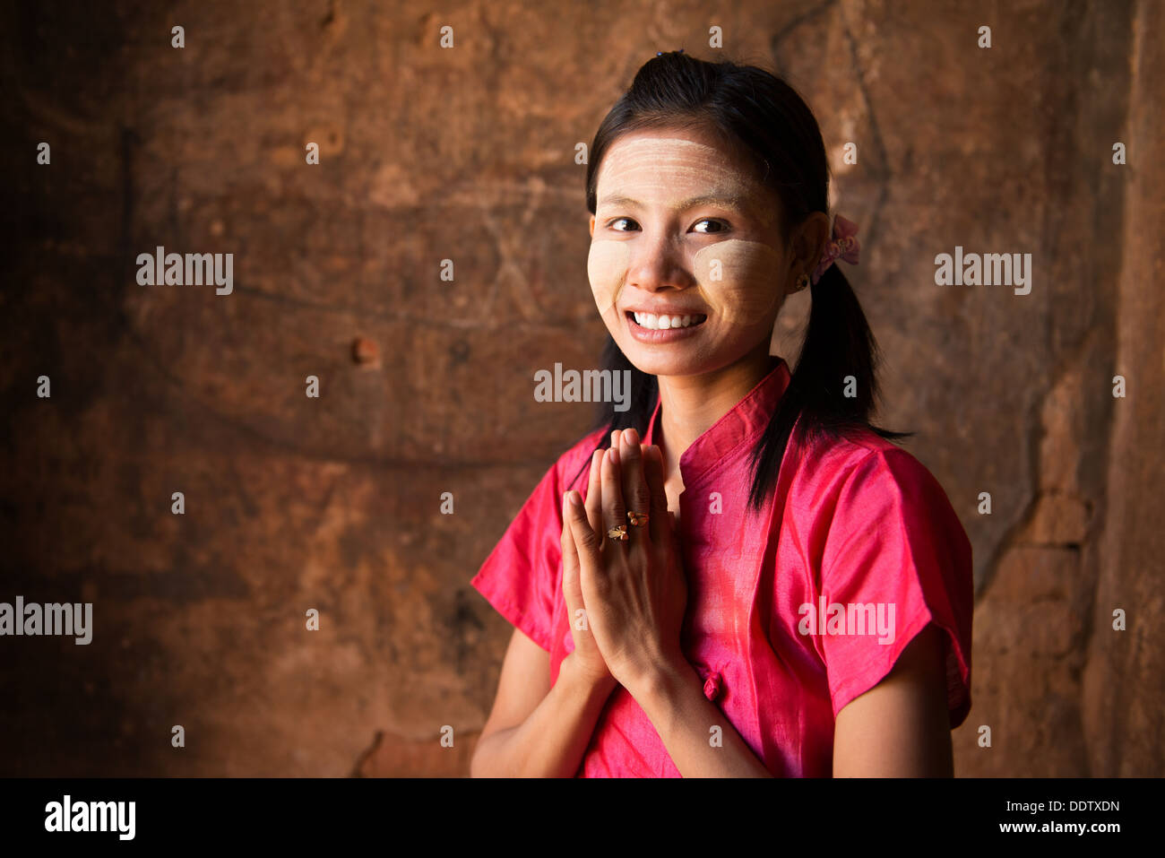 Myanmar girl in a traditional welcoming gesture Stock Photo - Alamy