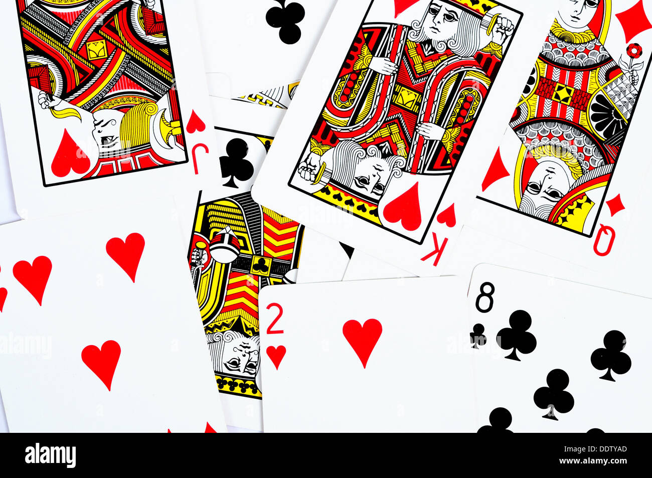 Traditional playing cards scattered Stock Photo - Alamy