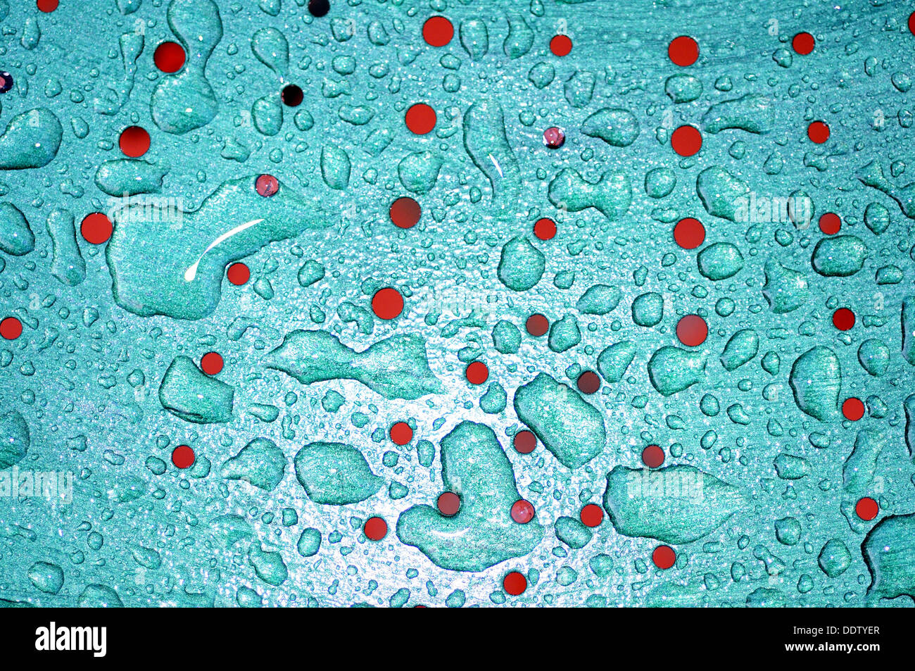 Rain spots on a green metallic tabletop Stock Photo - Alamy