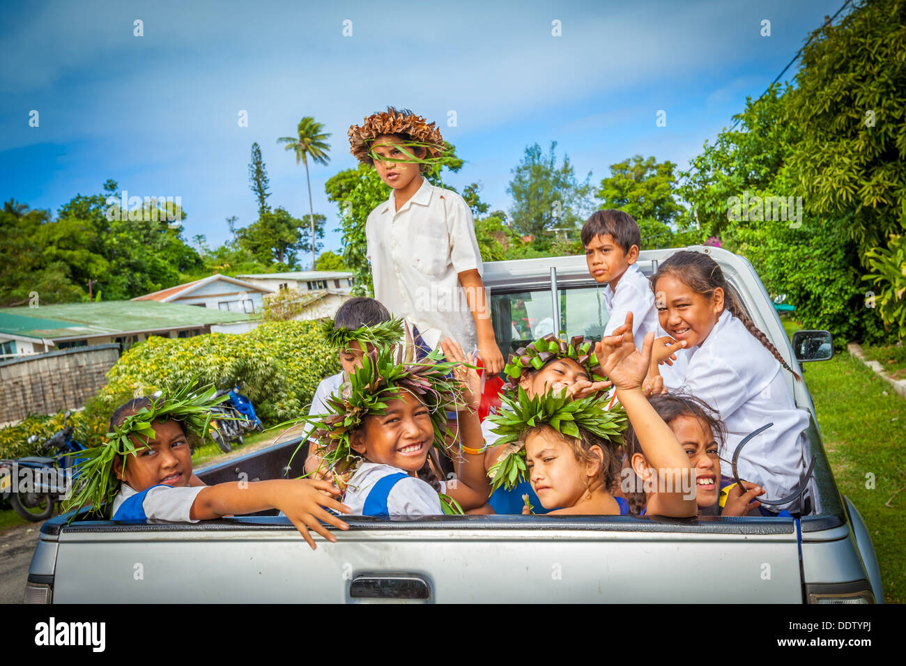 Aitutaki island, kids with leafy headbands during the celebration of ...