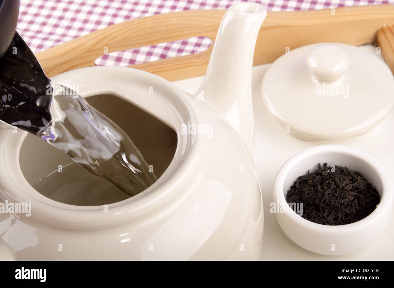 water is filled into a teapot Stock Photo - Alamy