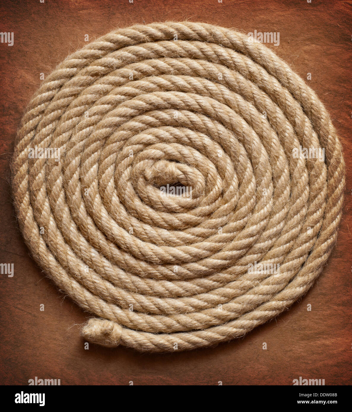 Aged Rope on the old paper background Stock Photo - Alamy