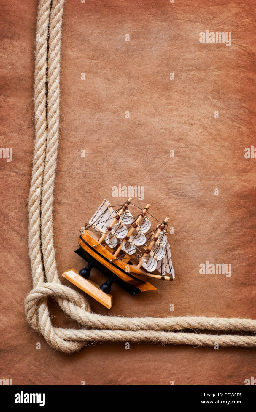 Aged Rope and ship on the old paper background Stock Photo - Alamy