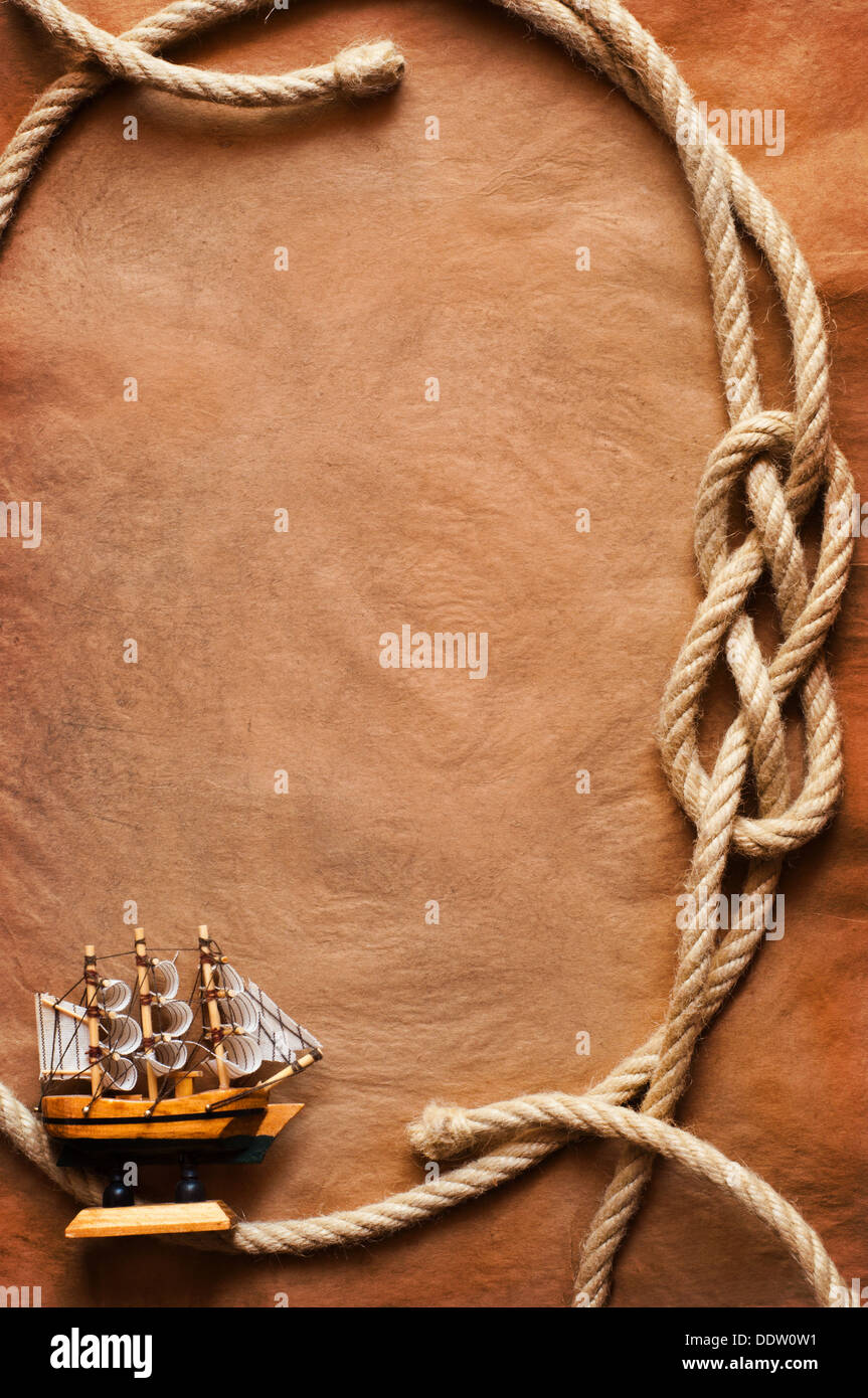 Aged Rope and ship on the old paper background Stock Photo - Alamy
