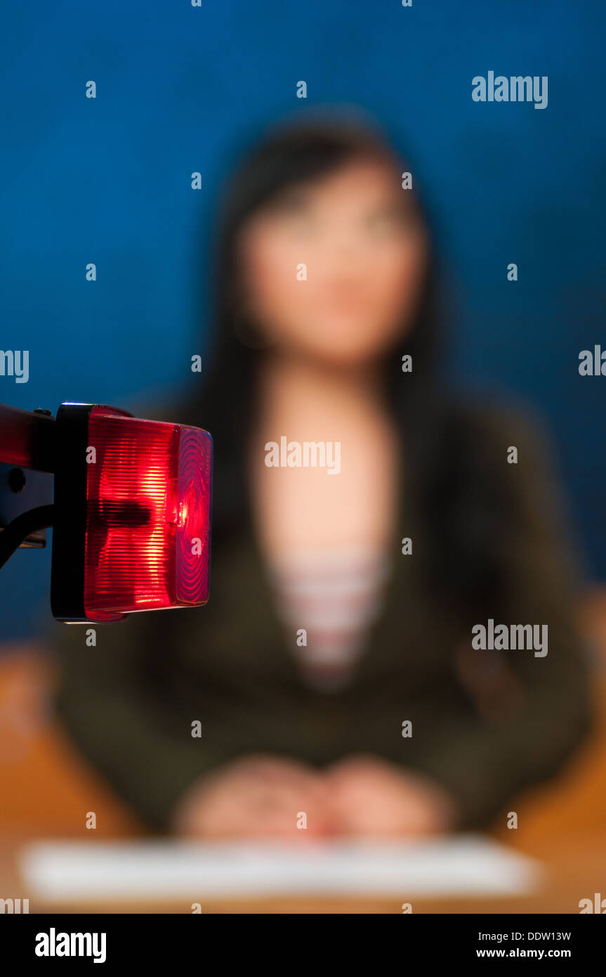 Reporter presenting news in TV studio - On the air sign Stock Photo - Alamy