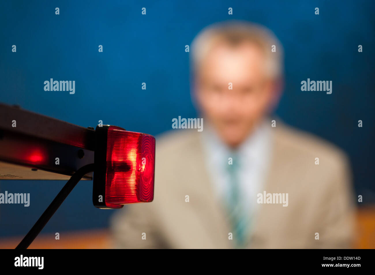 Reporter presenting news in TV studio - On the air sign Stock Photo - Alamy