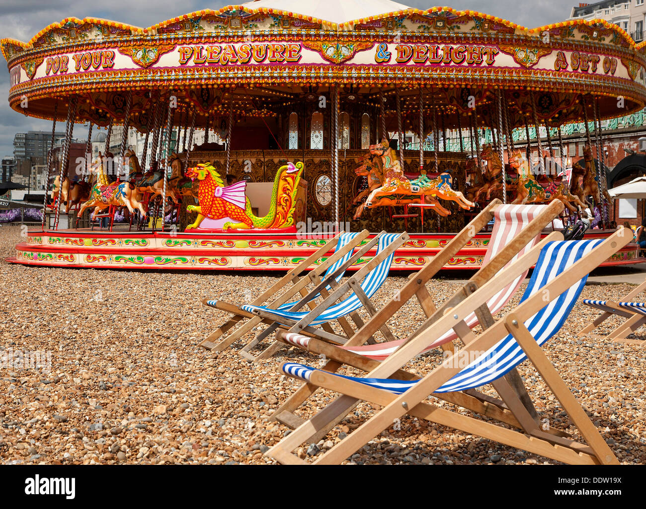 Old Fashioned Carousel and Deck chairs on Brighton Beach Stock Photo ...