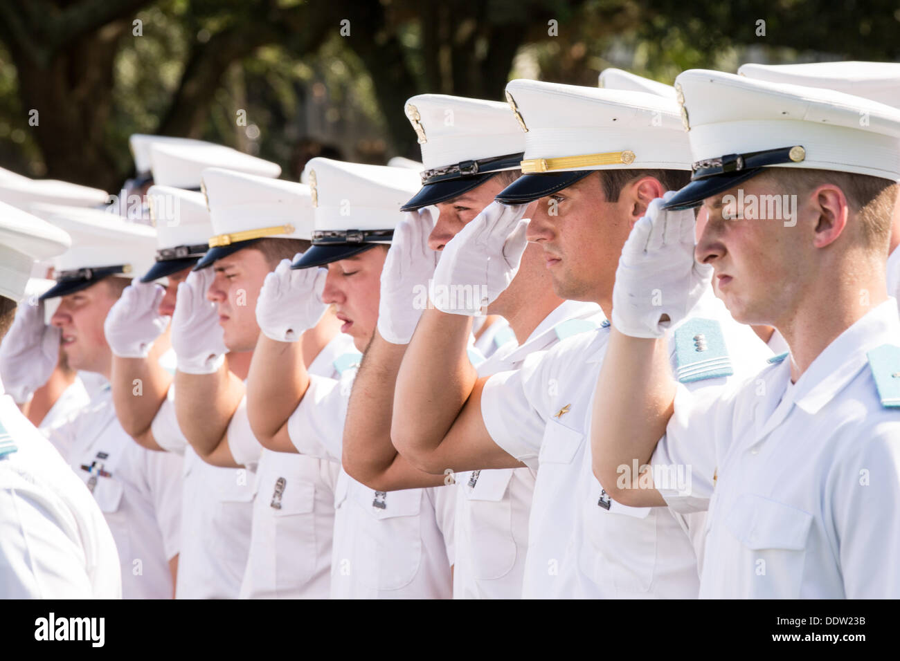 Members of the Citadel Military College corps of cadets salute during ...