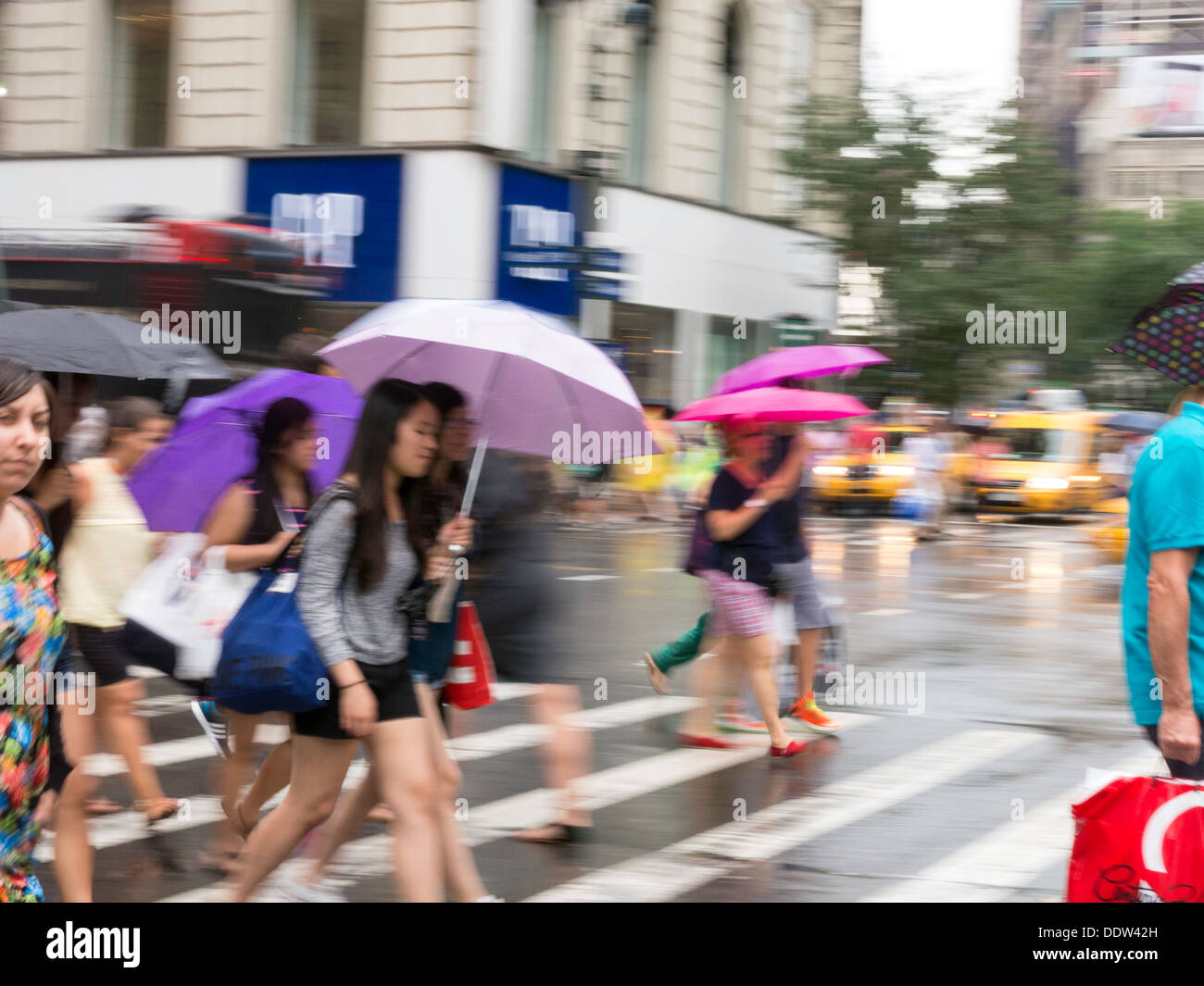 Pedestrians in Rainstorm under Brollies at Herald Square, NYC Stock ...