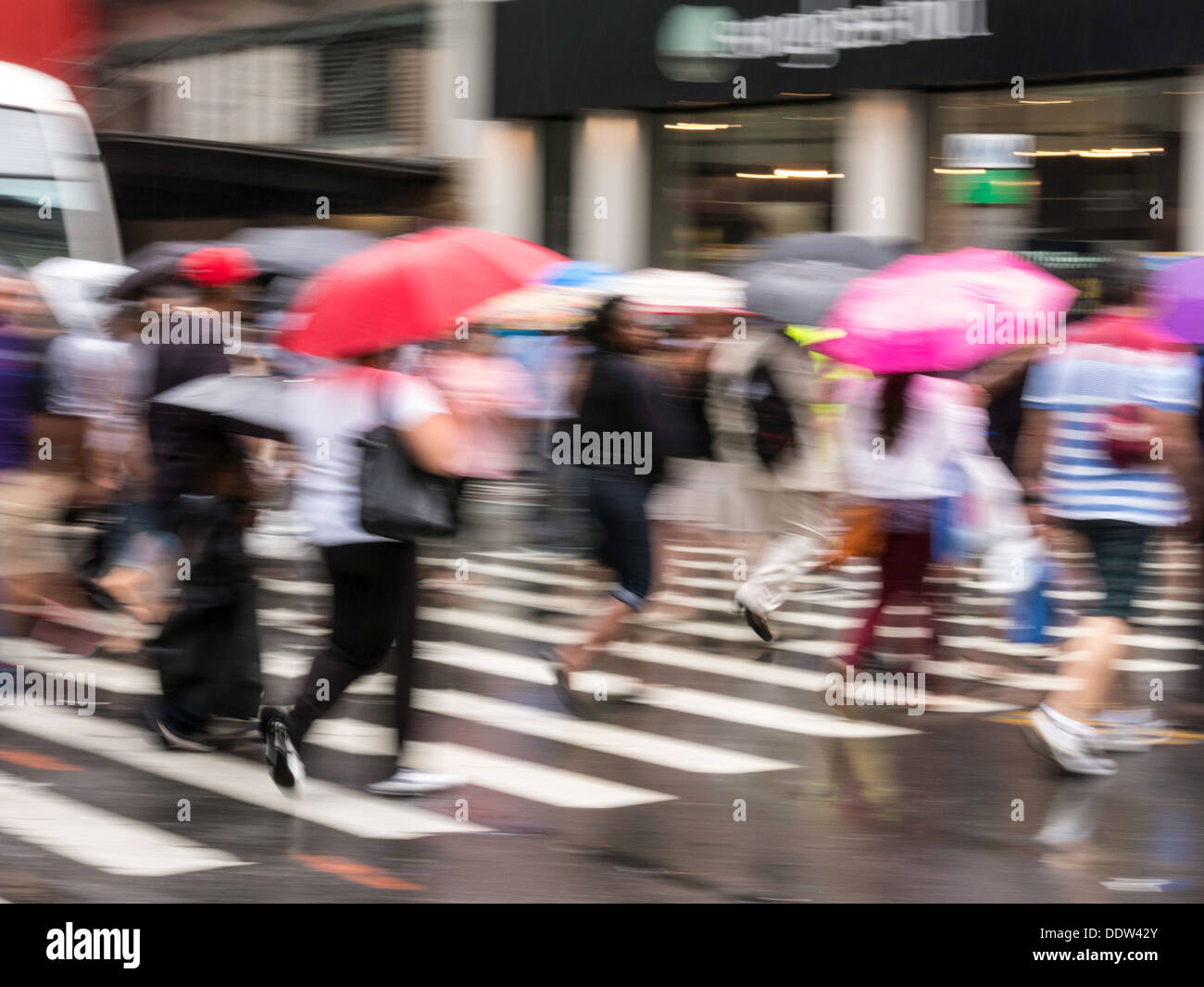 Pedestrians under Brollies in Rainstorm at Herald Square, NYC Stock ...