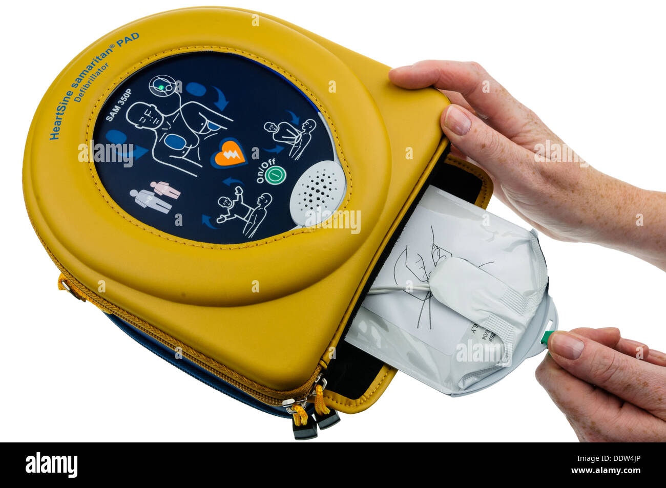 Woman removes the pads from a Heartsine SAM350P automatic defibrillator ...