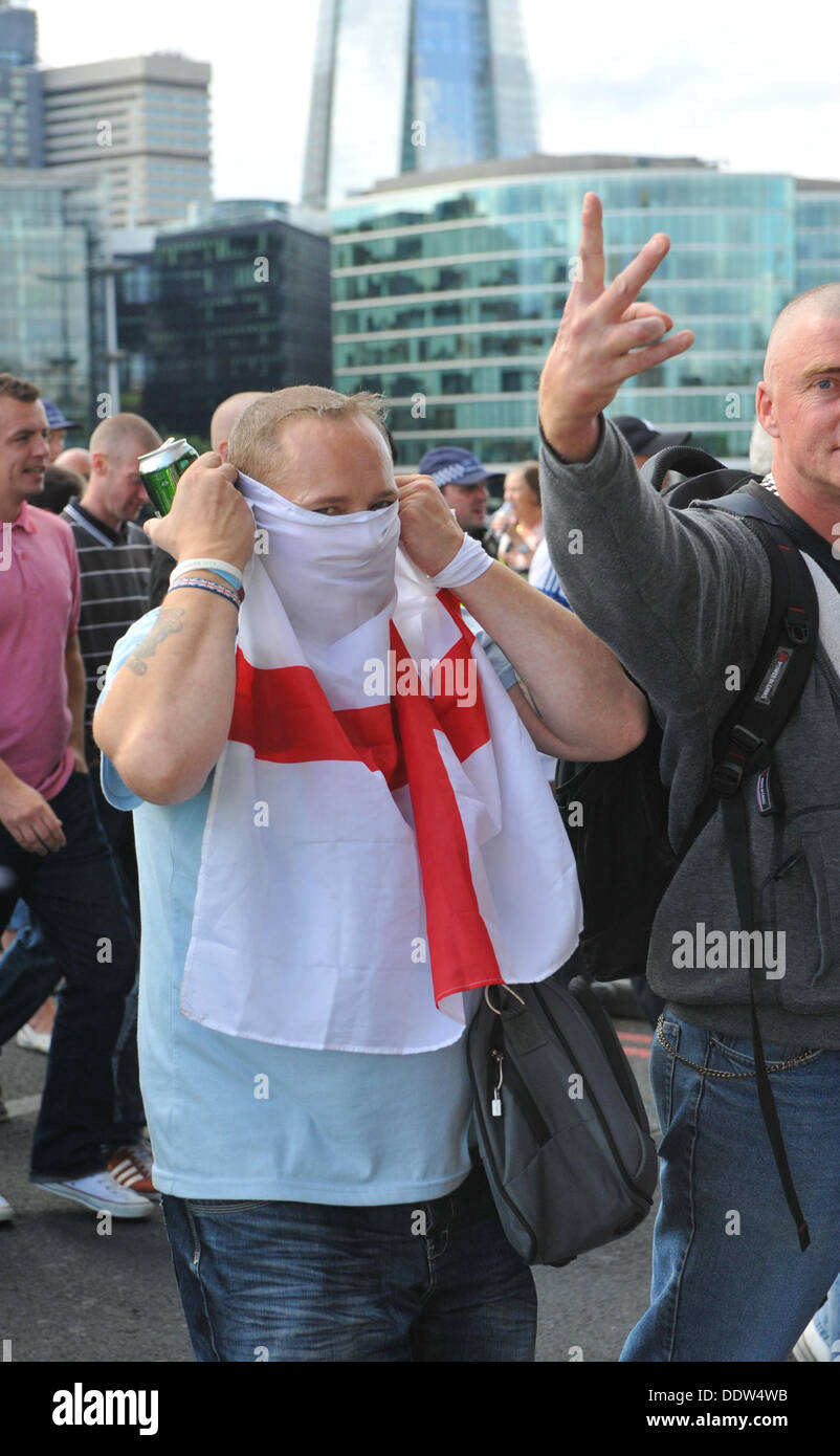 Tower Bridge, London, UK. 7th September2013. Holding flags and banners ...