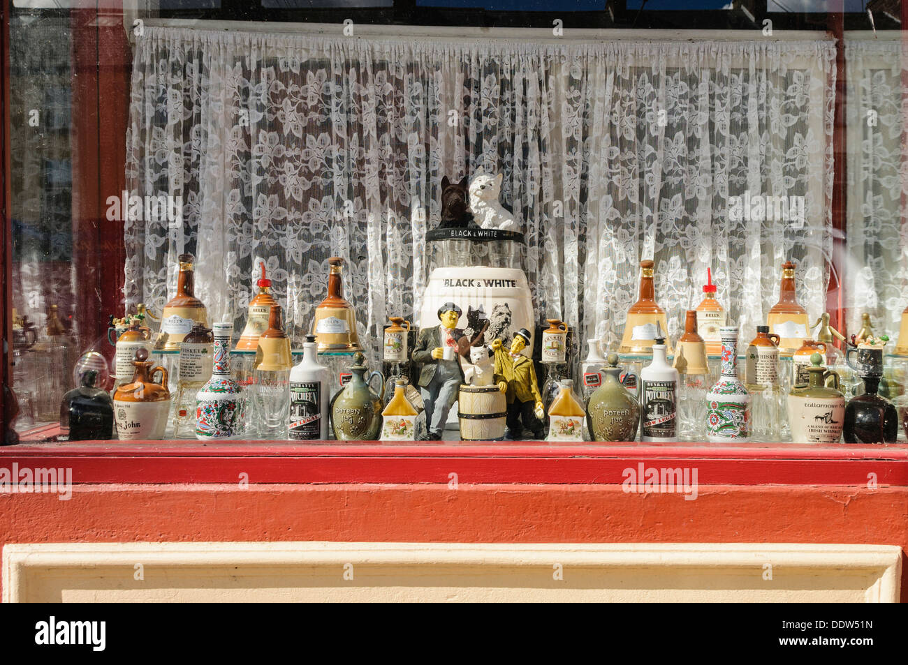 Whiskey and other drink bottles on display in the window of a typical ...
