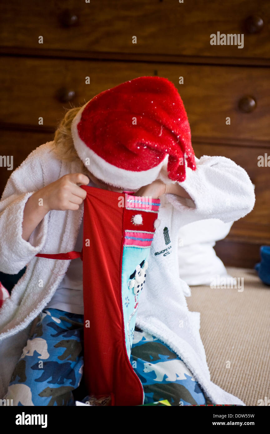 An excited child looks in his Christmas Stocking Stock Photo - Alamy