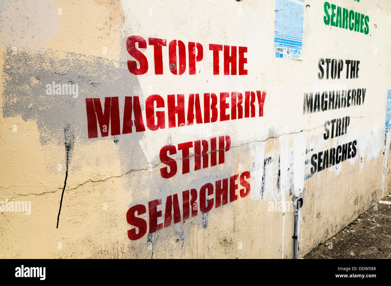 Stenciled graffiti on a wall saying "Stop the Maghaberry strip searches ...