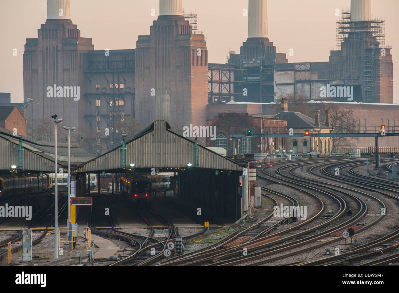 Trains in a depot at Victoria with Battersea Power Station in the ...
