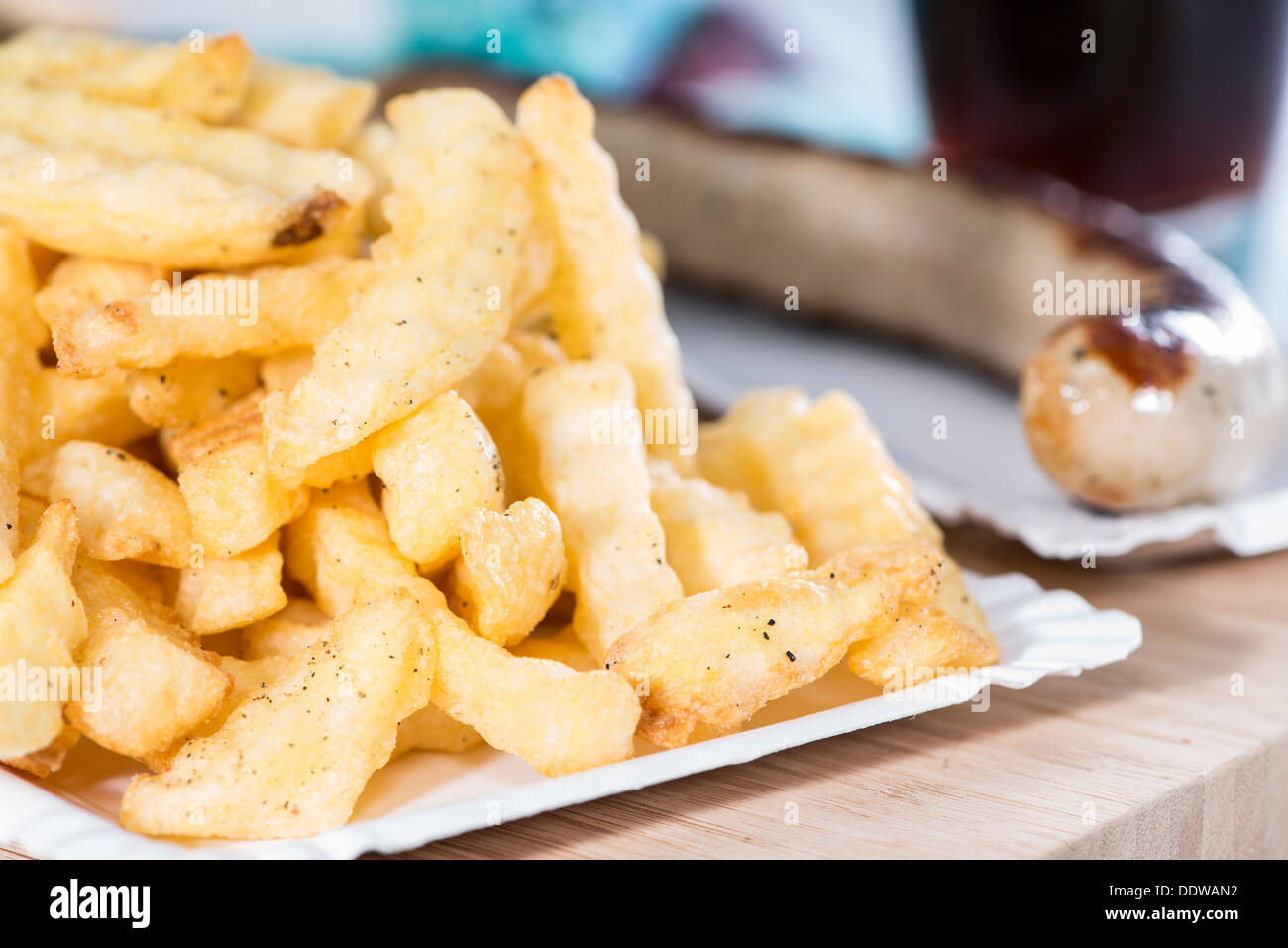 German Bratwurst with portion of French Fries Stock Photo - Alamy