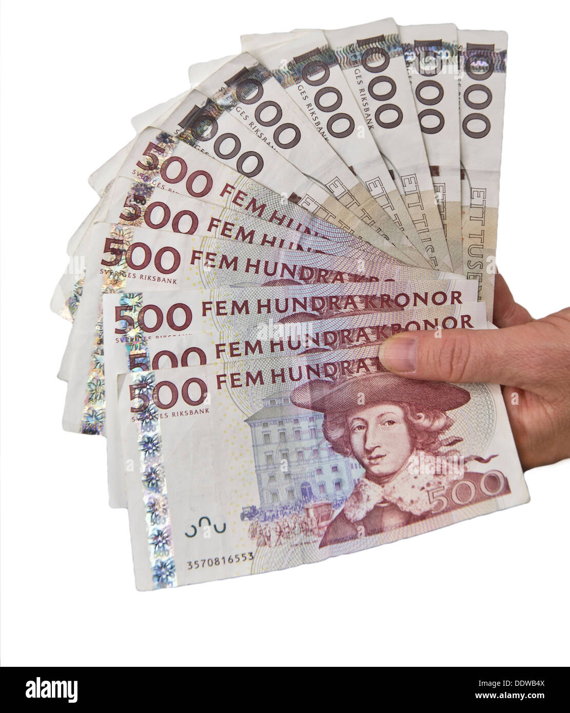 Handful of Swedish 500 and 1000 bills isolated on white background ...