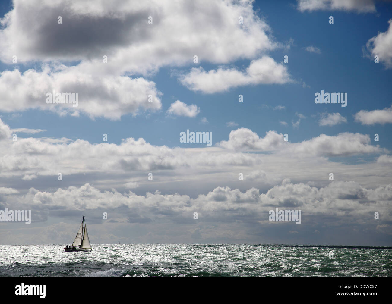 Sailing Boat under dramatic sky Stock Photo - Alamy