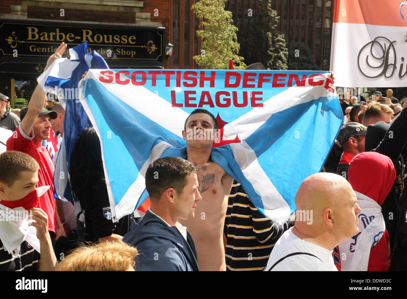 London, UK. 7 September 2013. A EDL member poses with his flag at ...