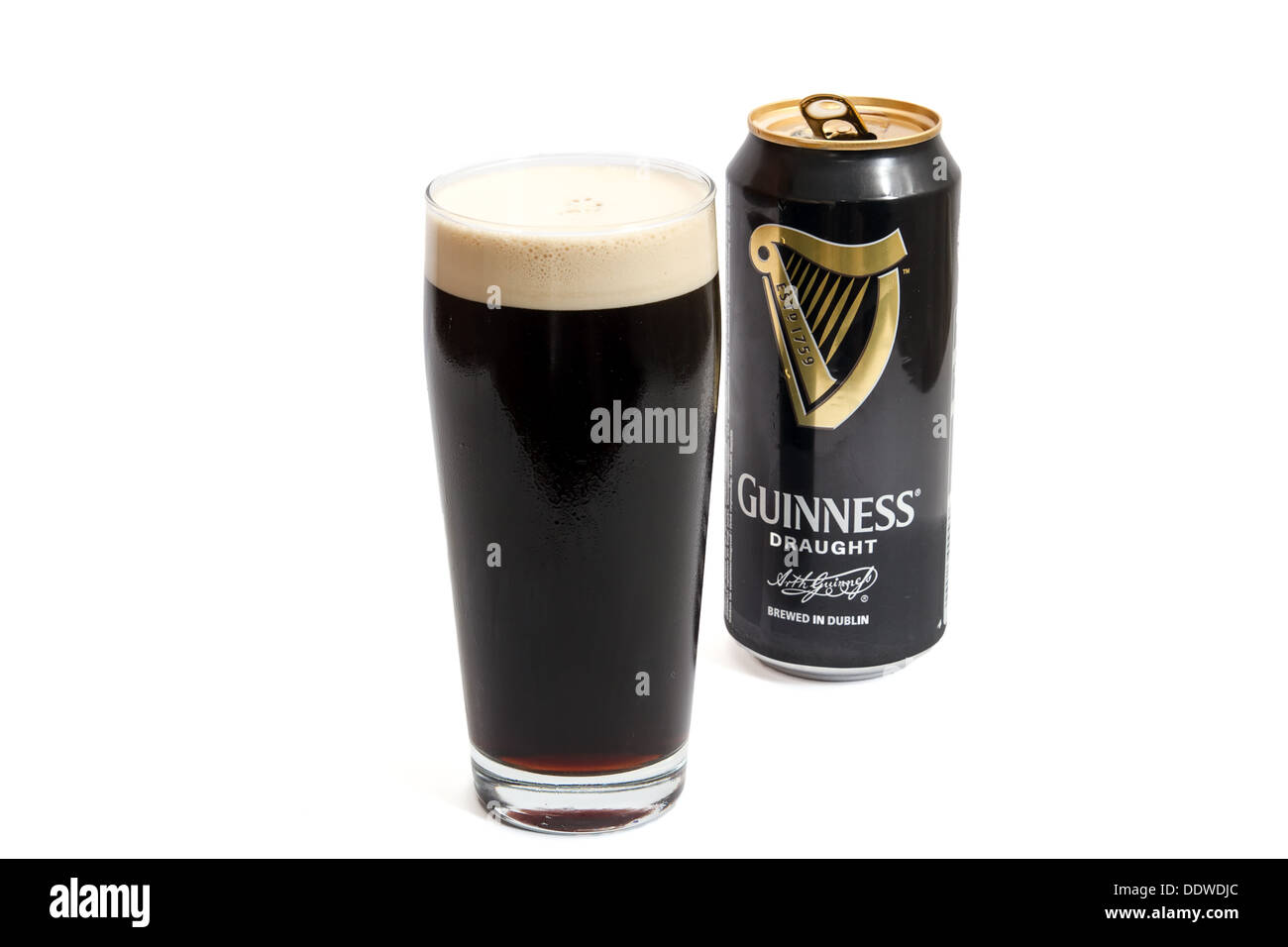 Pint of draught guinness and can Stock Photo - Alamy
