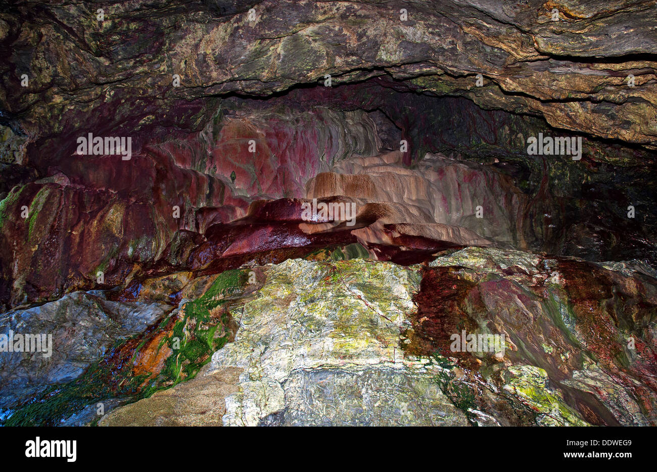 The Holy Well inside a sea cave at Holywell Bay near Newquay in ...