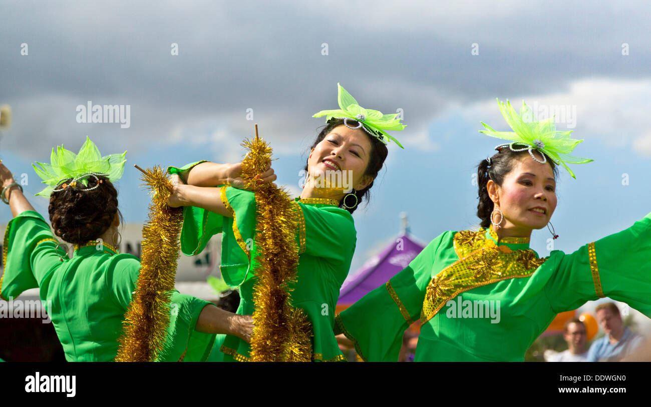 Female dancers performing a Chinese dance at the Dragon Boat Festival ...