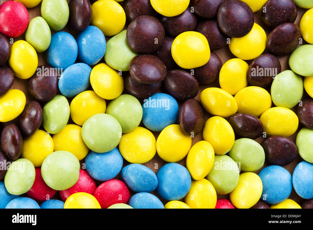 Chocolate dragees. Background Stock Photo - Alamy