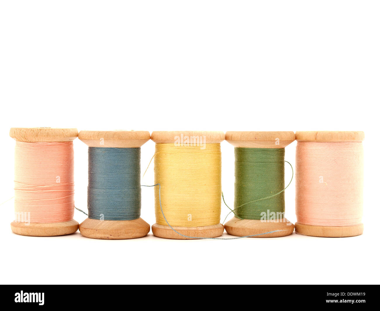 Threads on a white background Stock Photo - Alamy