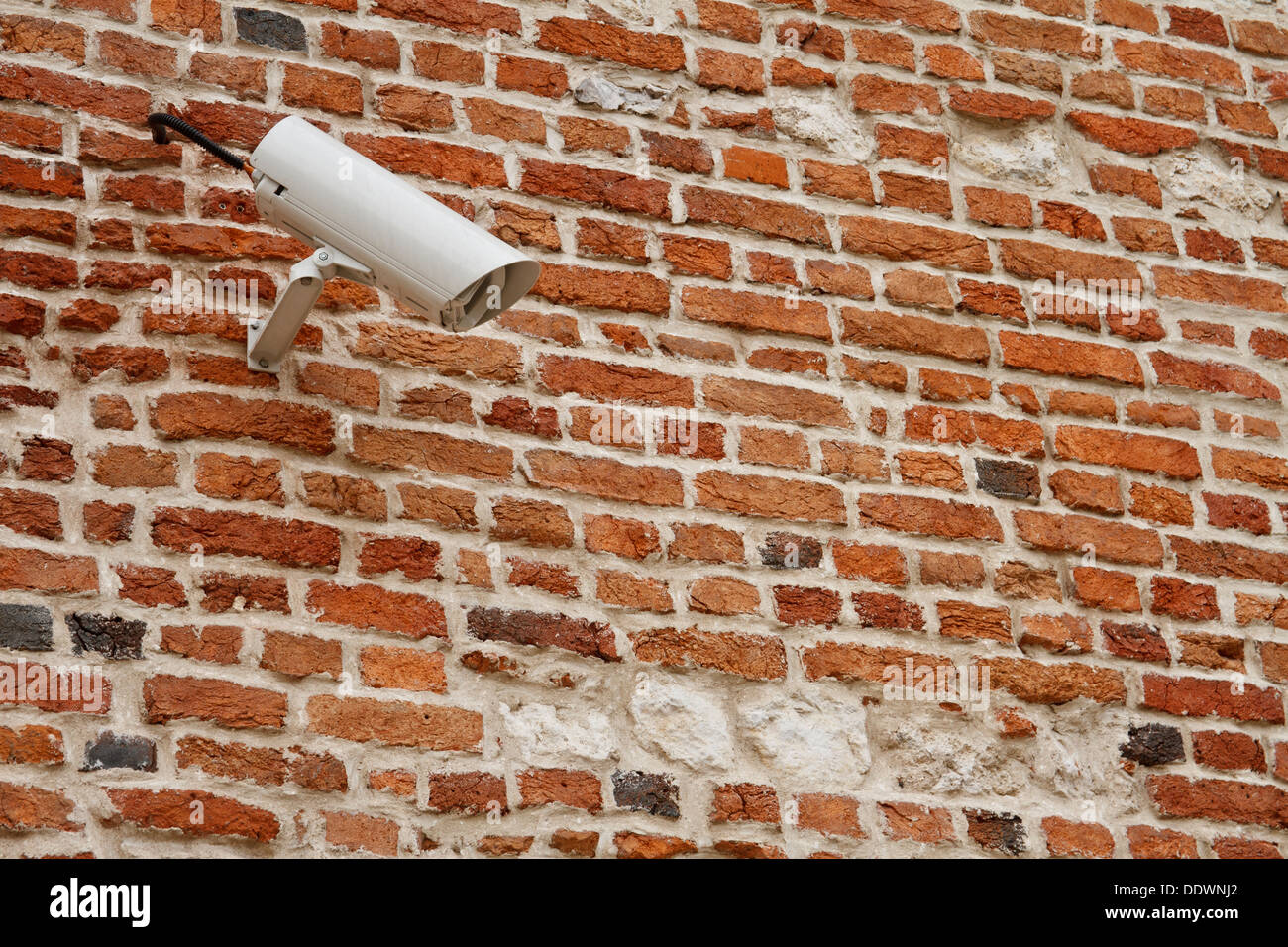 CCTV camera on ancient brick wall Stock Photo - Alamy
