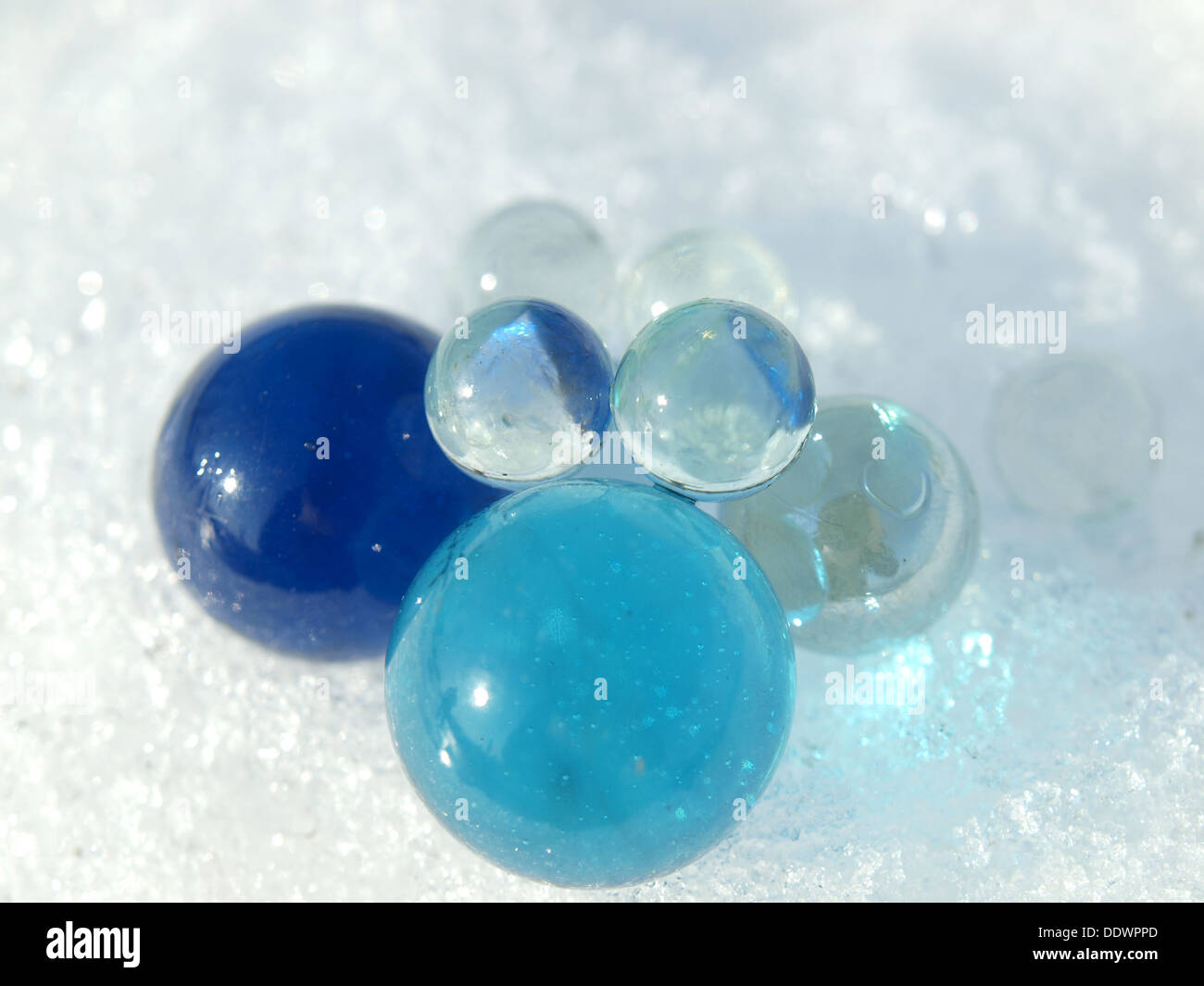 Blue and transparent balls on a snow in the winter Stock Photo - Alamy