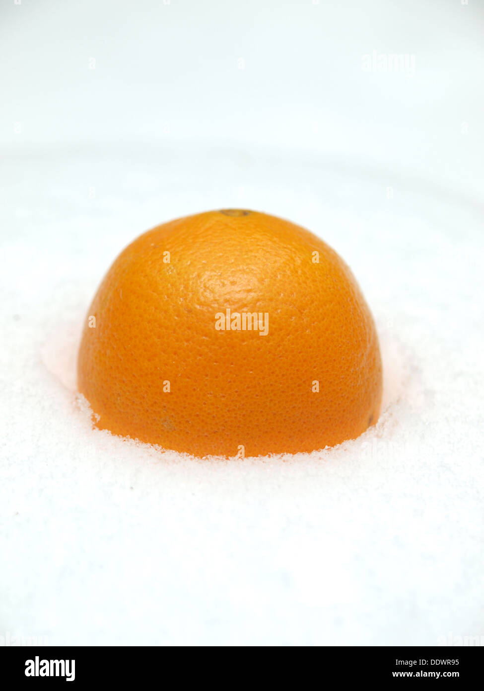 Orange on snow Stock Photo - Alamy
