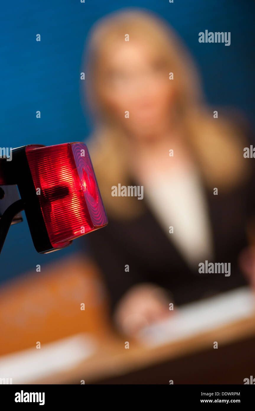 Reporter presenting news in TV studio - On the air sign Stock Photo - Alamy