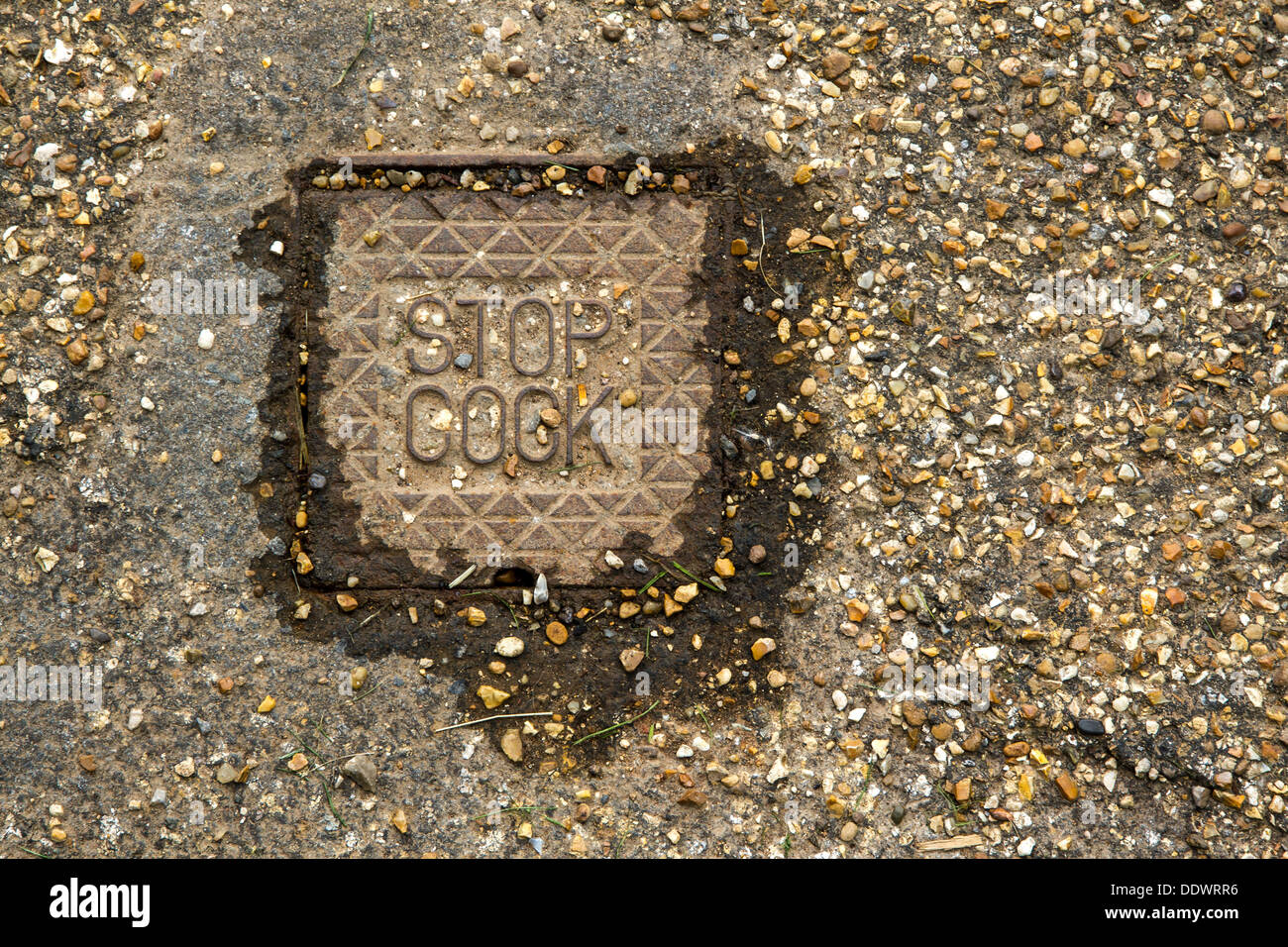 Water stop cock cover in a gravel path Stock Photo - Alamy