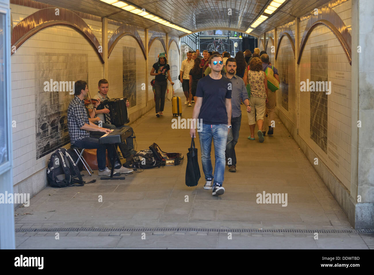 Street musicians performing in one of many alleys in London, with ...