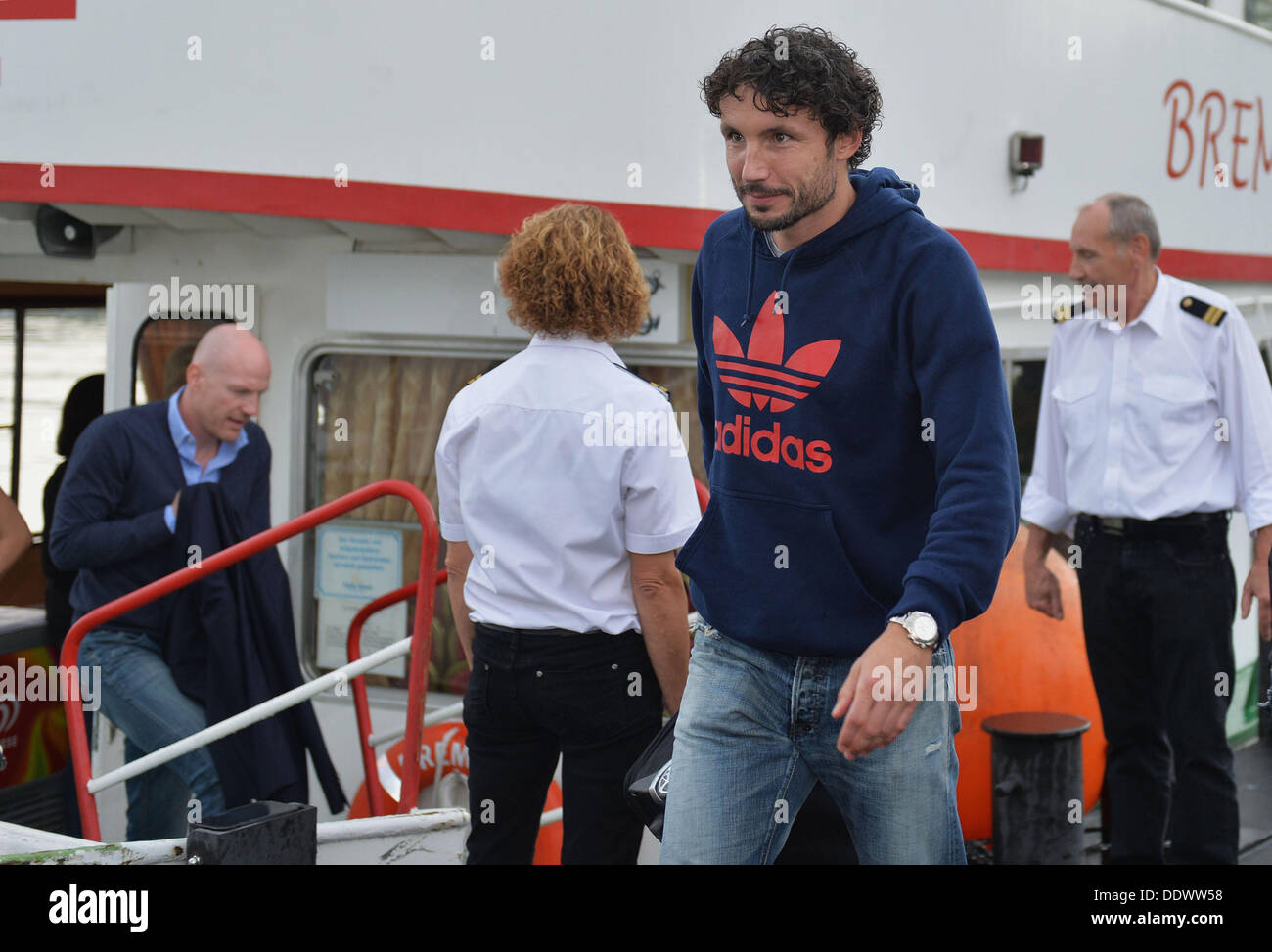 Former soccer players Mark van Bommel (R) and Matthias Sammer (L ...