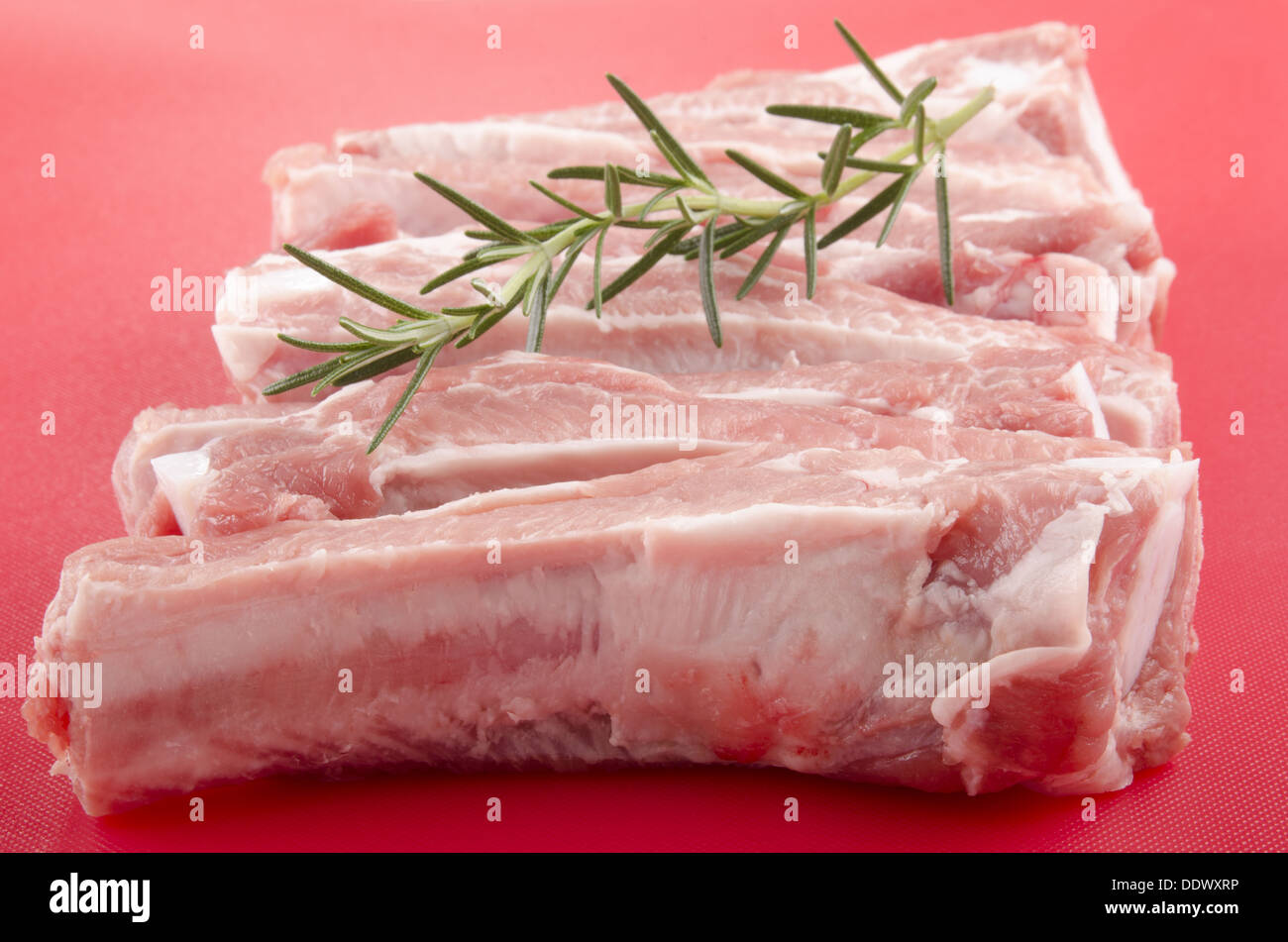 raw pork ribs on a color coded cutting board Stock Photo - Alamy