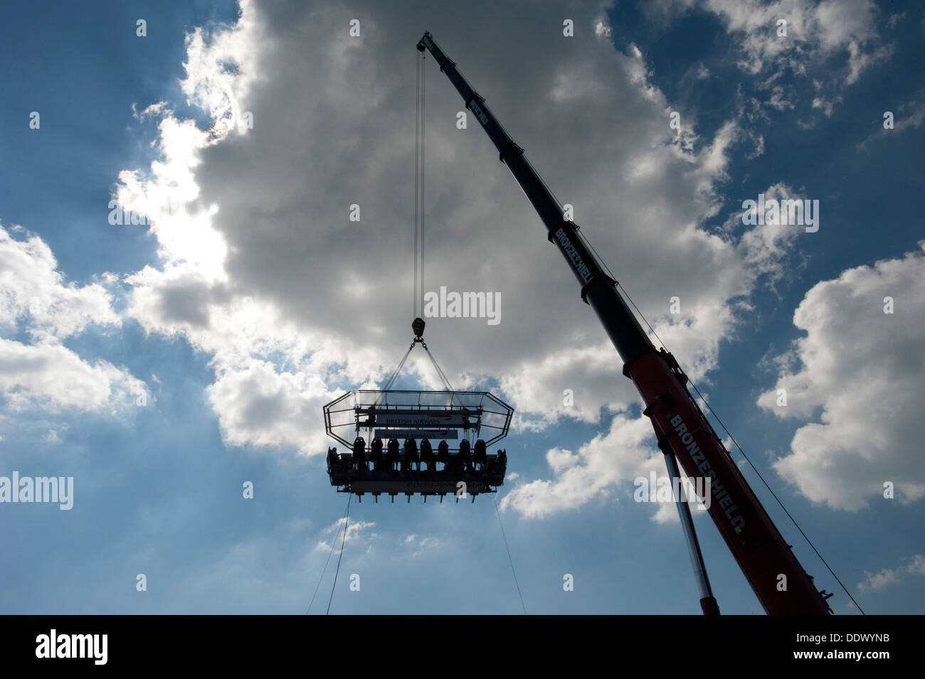 A British Airways high-flying dining table dangling from a crane with ...