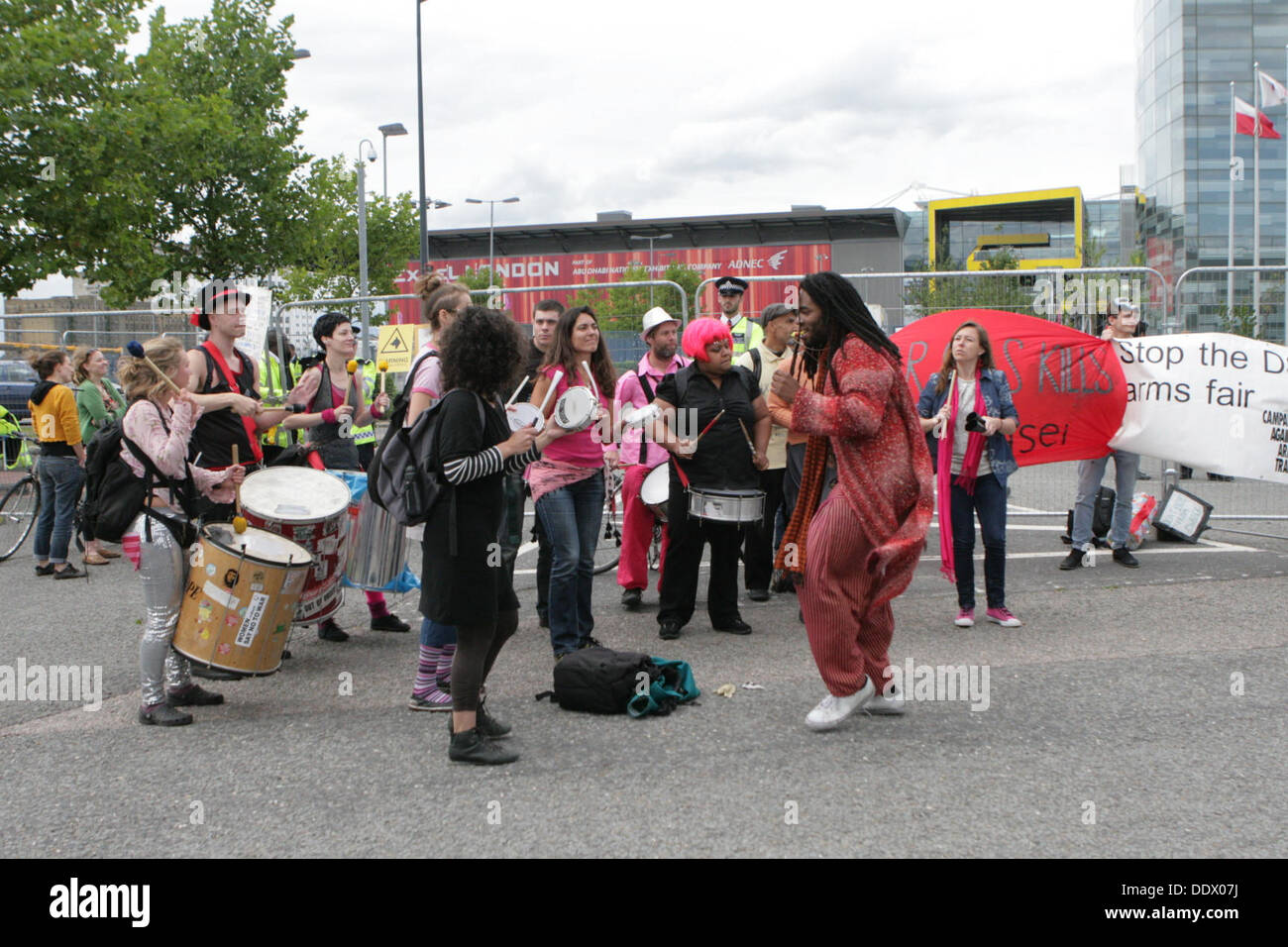 London, UK. 8th Sep, 2013. Protesters play music and dance during ...