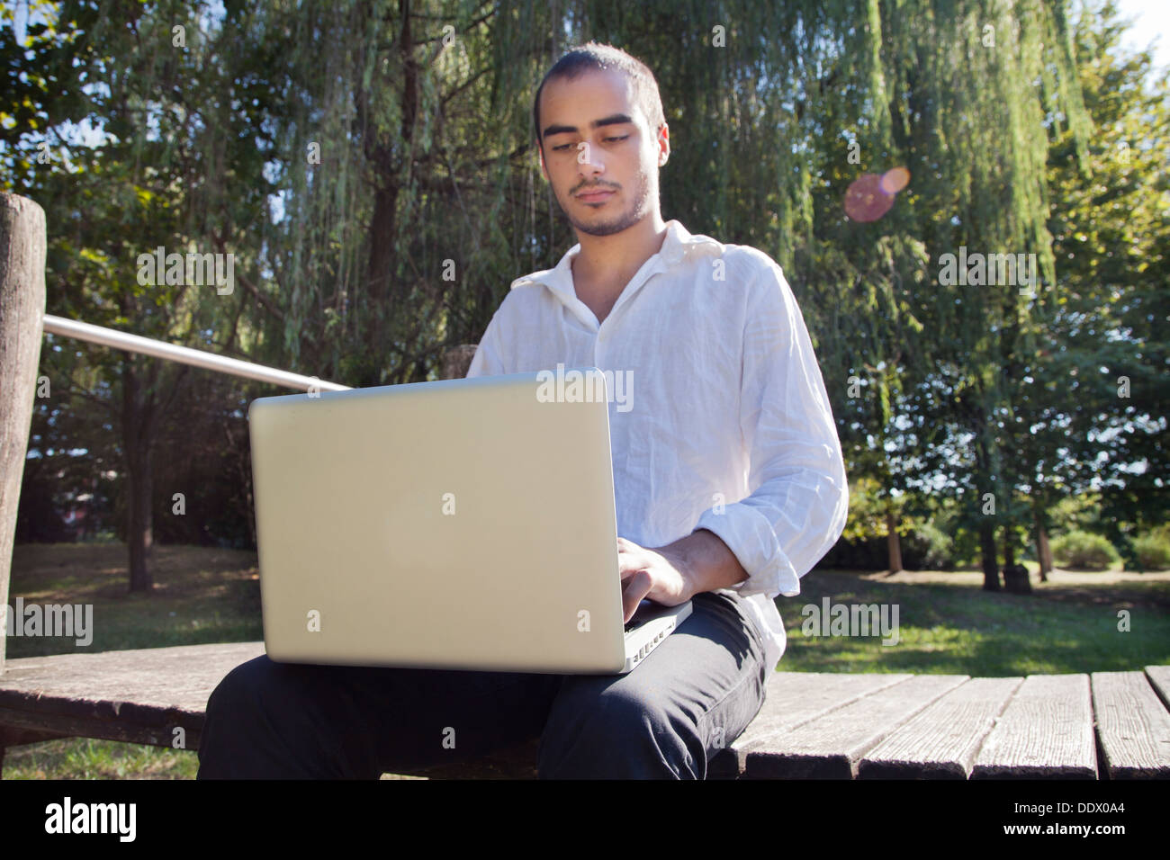 boy on computer outdoor Stock Photo - Alamy