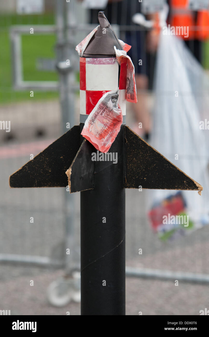 London, UK. 8th Sep, 2013. Blood money on prop missile at protest ...