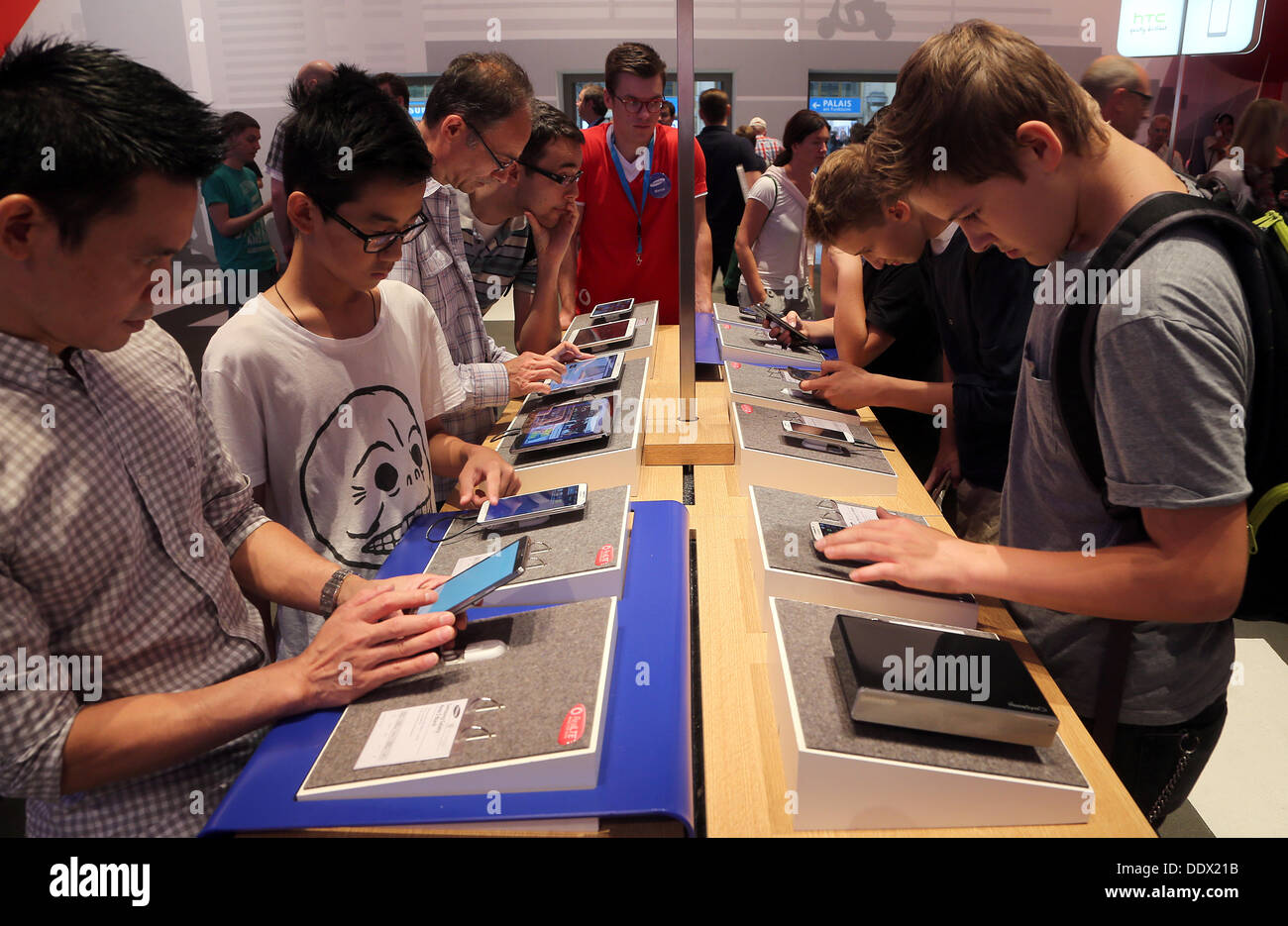 Berlin, Germany. 08th Sep, 2013. People stand at the Vodafone booth at ...