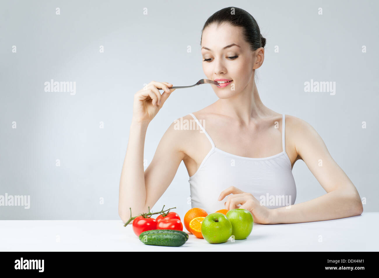 A beautiful slender girl eating healthy food Stock Photo - Alamy